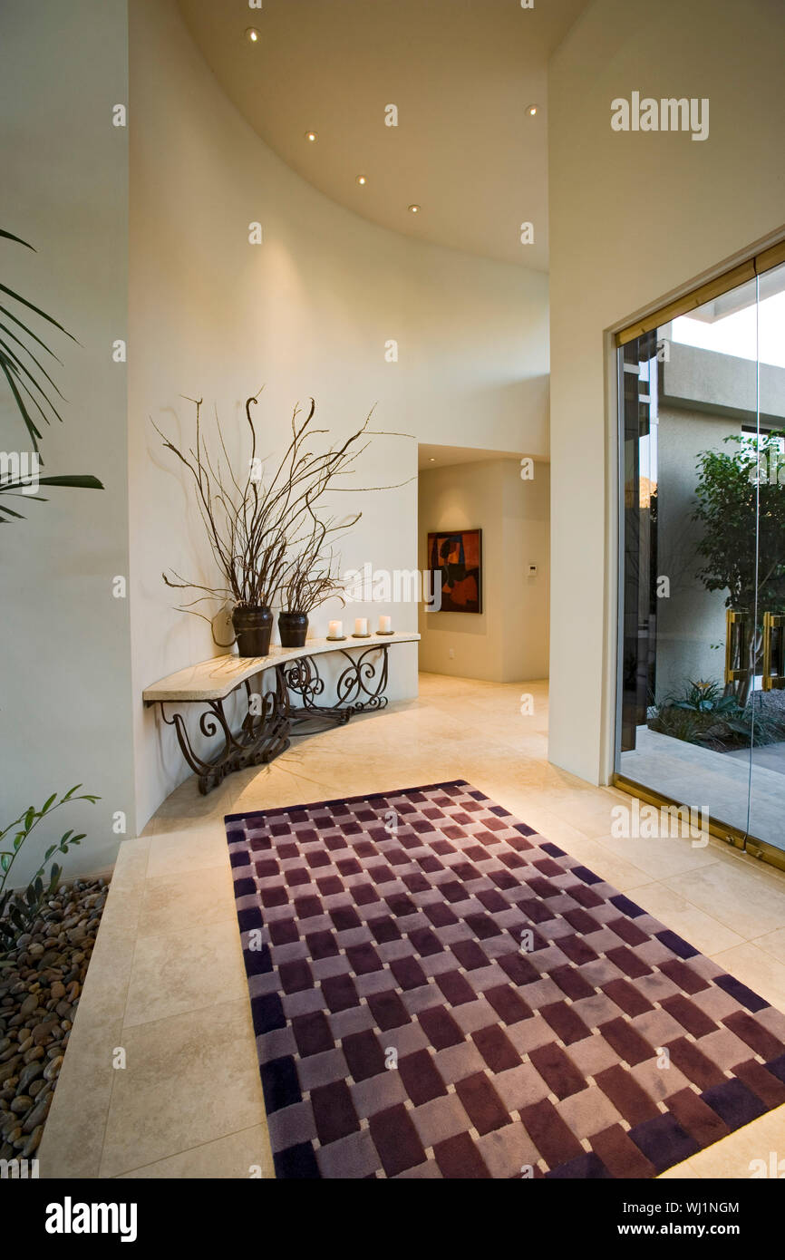Rug on empty tiled hallway across the modern house Stock Photo - Alamy