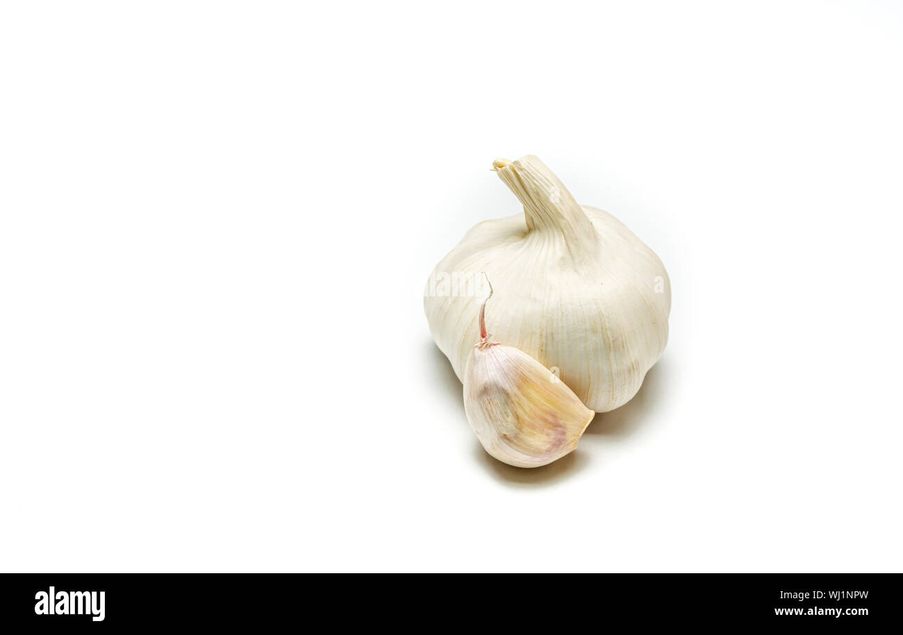 Close -up and color High-Key of Garlic bulb and garlic clove with red ...