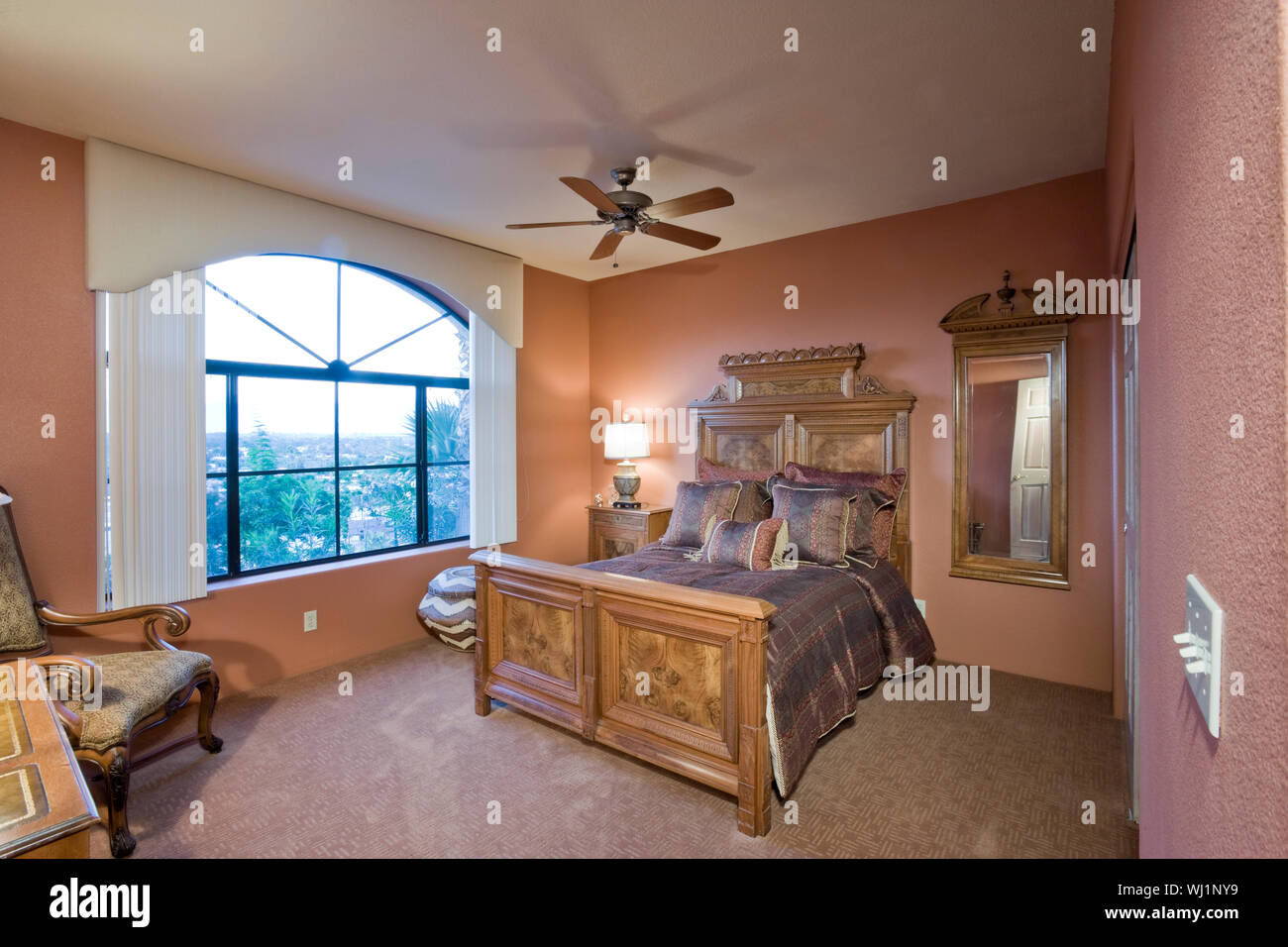 Spacious bedroom with outdoor view through window in a house Stock ...