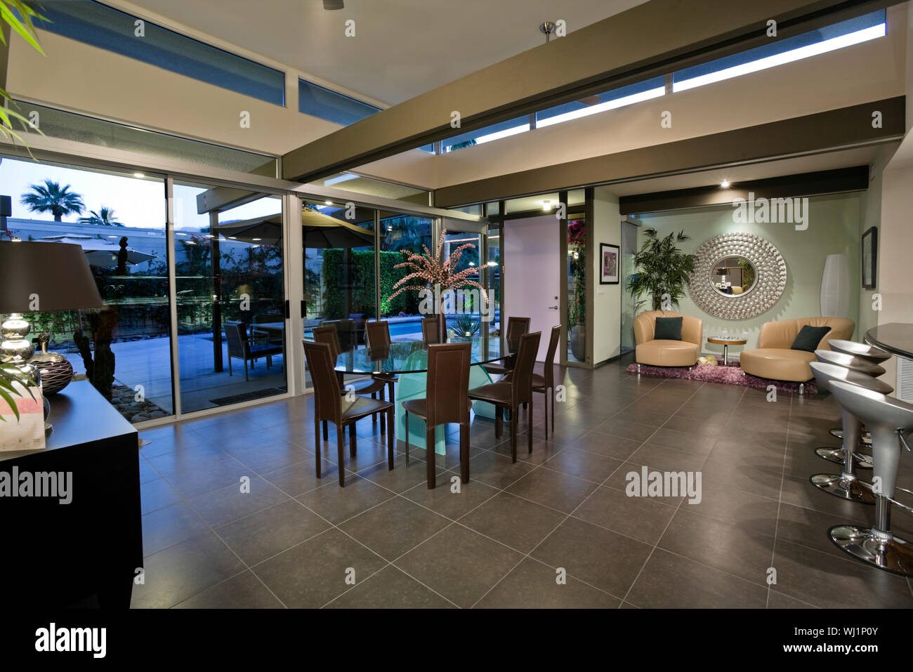 Open plan home interior with areas designated for dining and relaxing ...