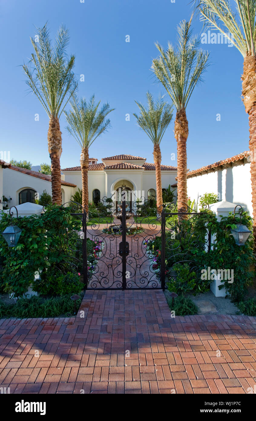 Entrance gate to luxurious house in colonial style Stock Photo - Alamy