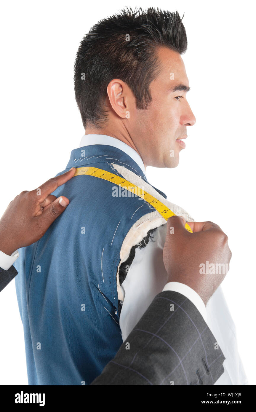 Profile view of man getting measured by tailor Stock Photo - Alamy