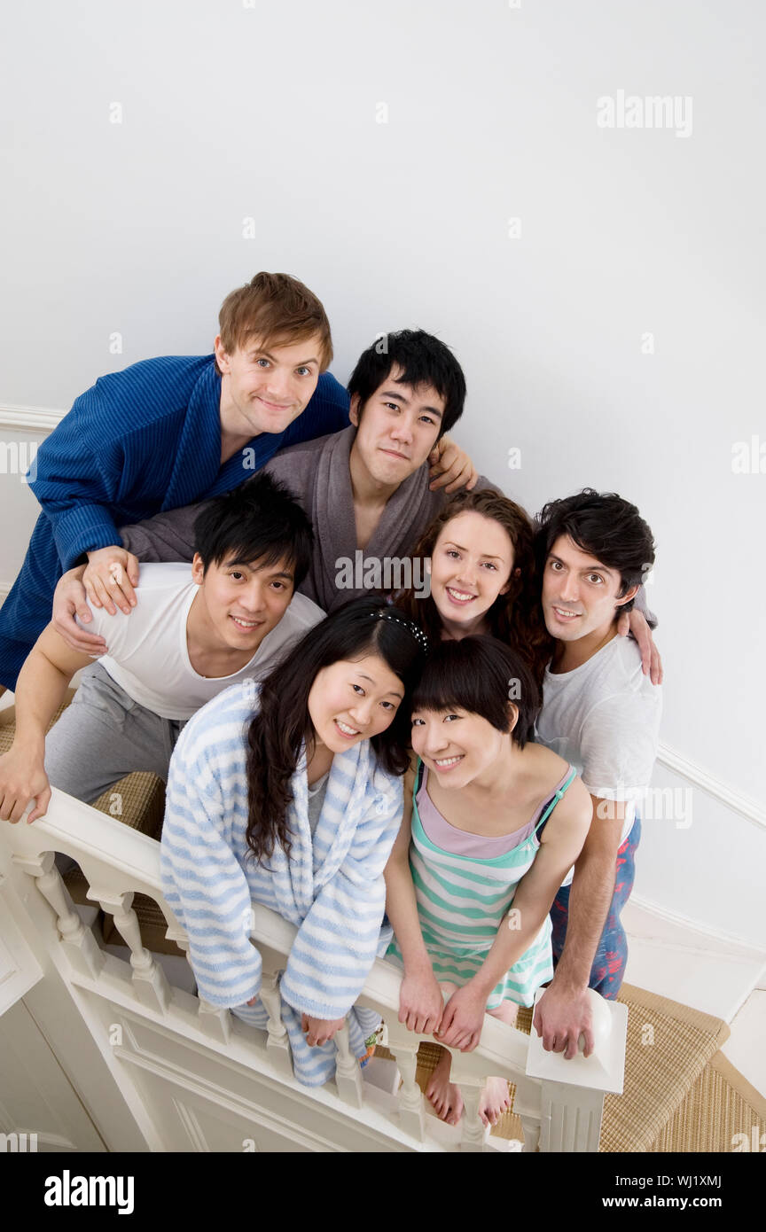Group portrait of friends on stairway Stock Photo - Alamy