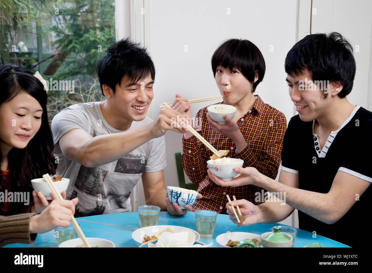 Friends enjoying breakfast together Stock Photo - Alamy
