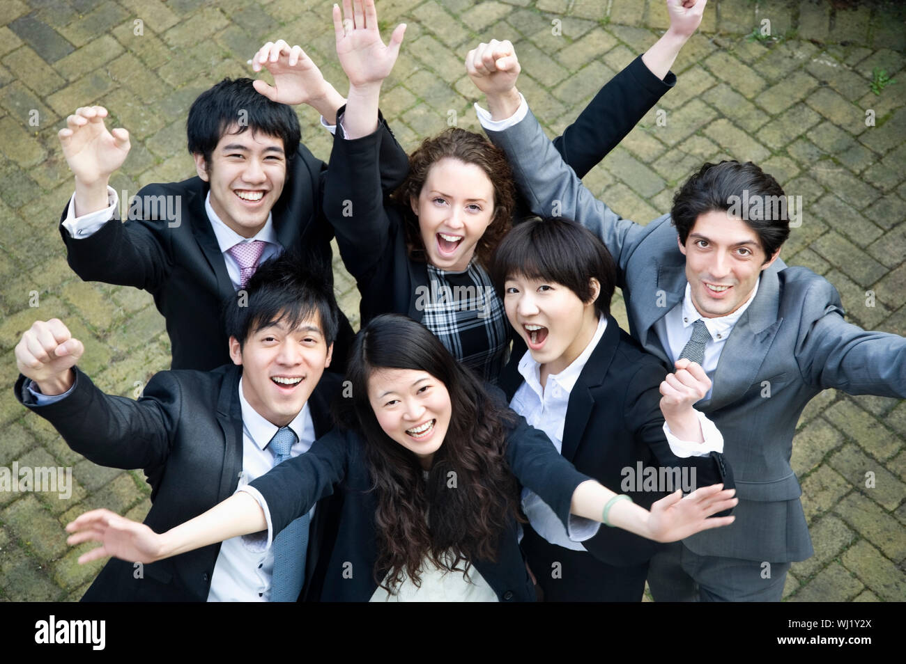 Men in suits celebrating outdoors hi-res stock photography and images ...