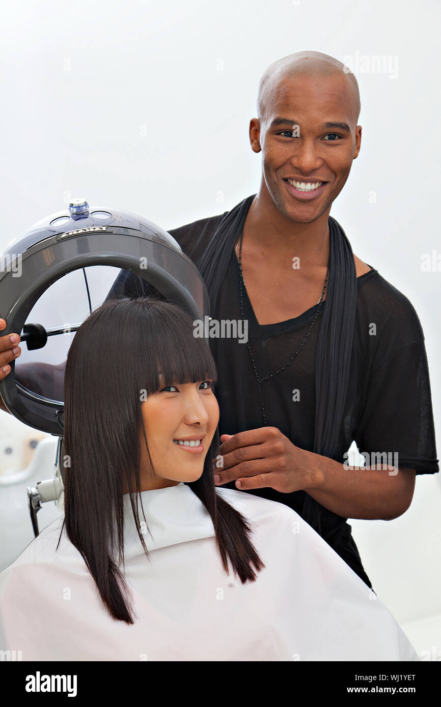 Asian woman getting herself groomed at hair salon Stock Photo - Alamy