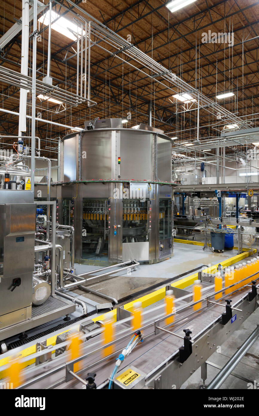 Bottles on production line at bottling plant Stock Photo - Alamy