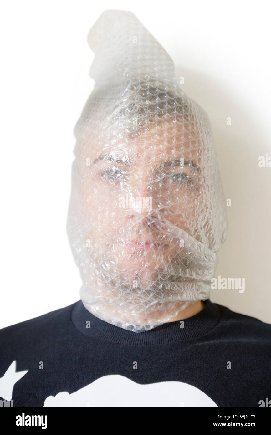 Portrait of man wrapped in bubble wrap Stock Photo Alamy