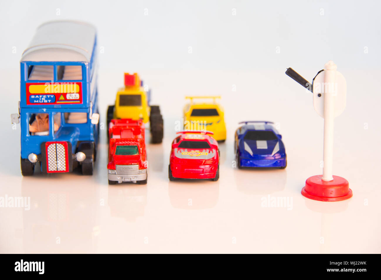 Toy cars waiting at traffic signal Stock Photo - Alamy