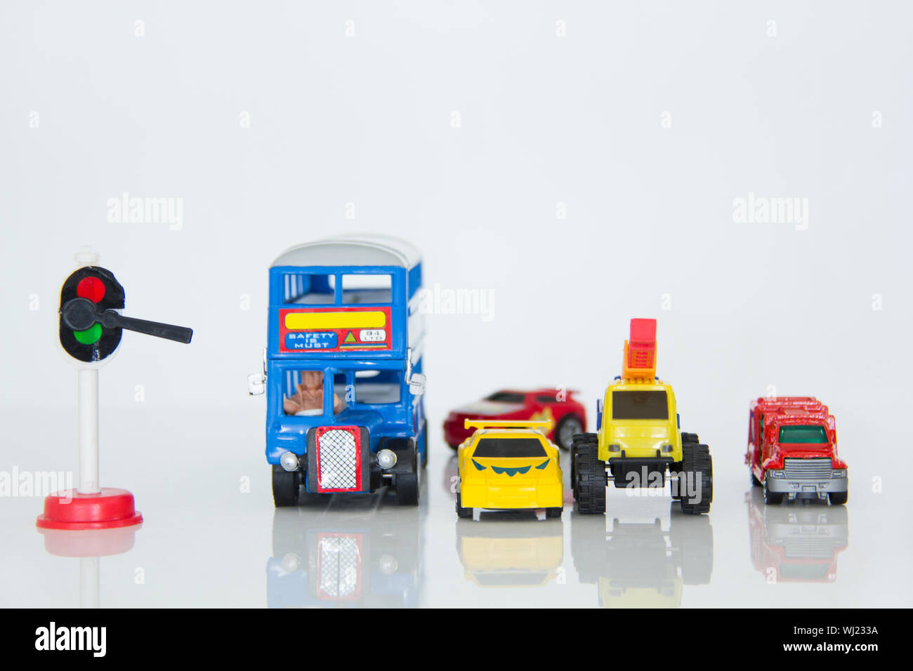 Toy cars waiting at traffic signal Stock Photo - Alamy