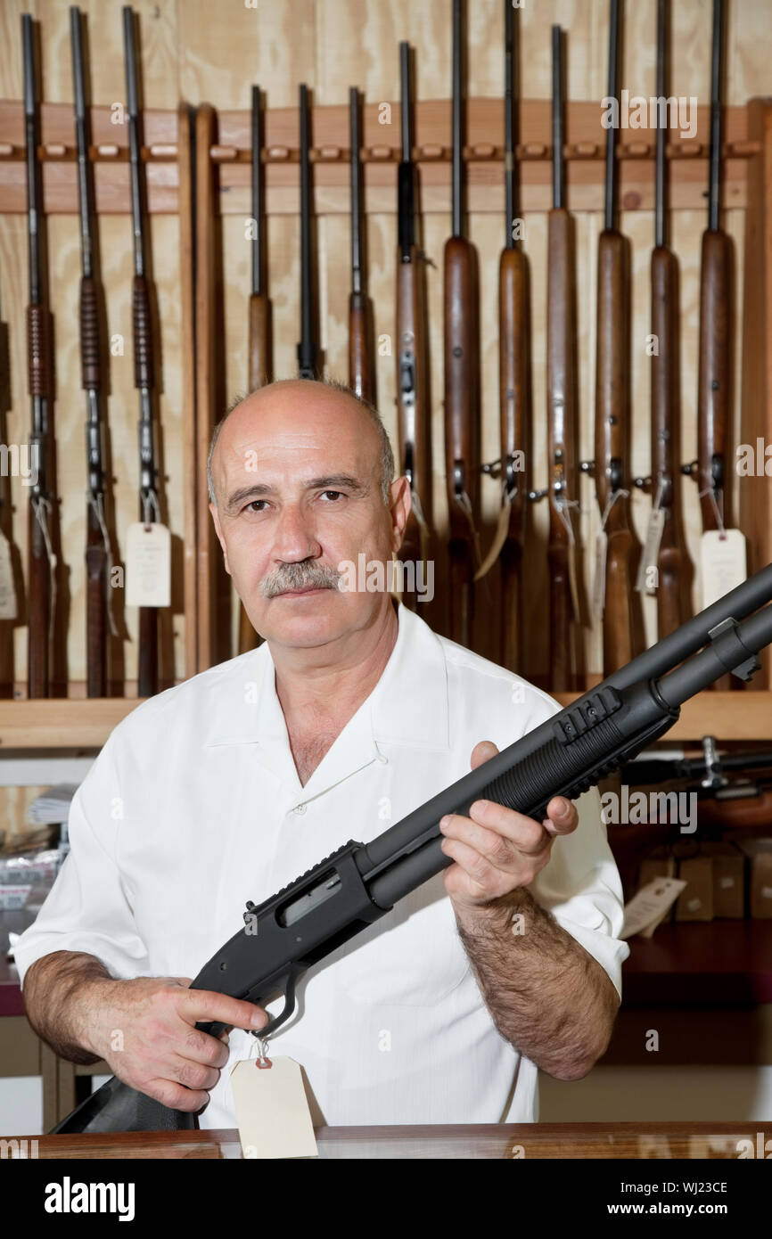 Mature gun shop merchant rifle hi-res stock photography and images - Alamy