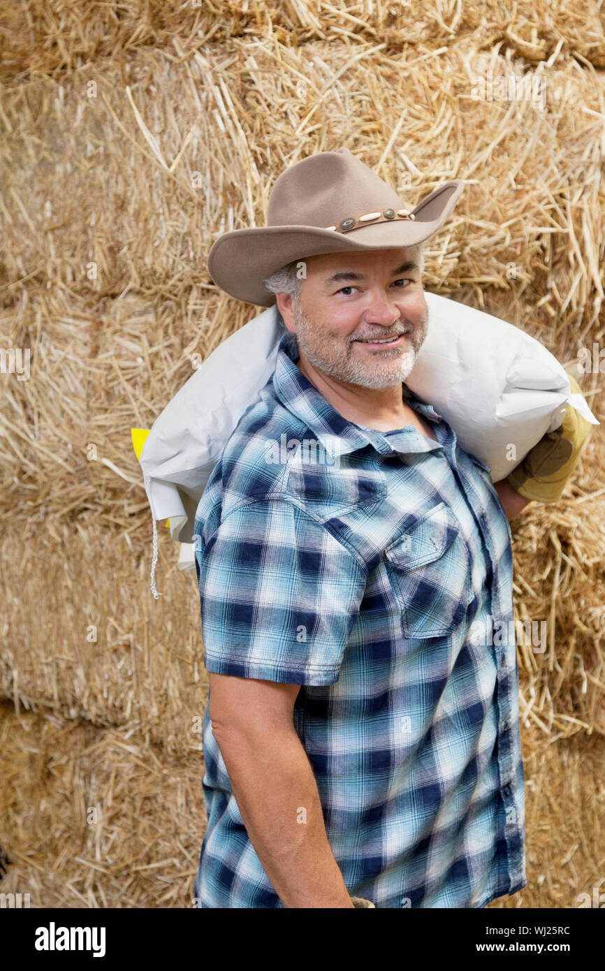 Man carrying sack on shoulder hi-res stock photography and images - Alamy