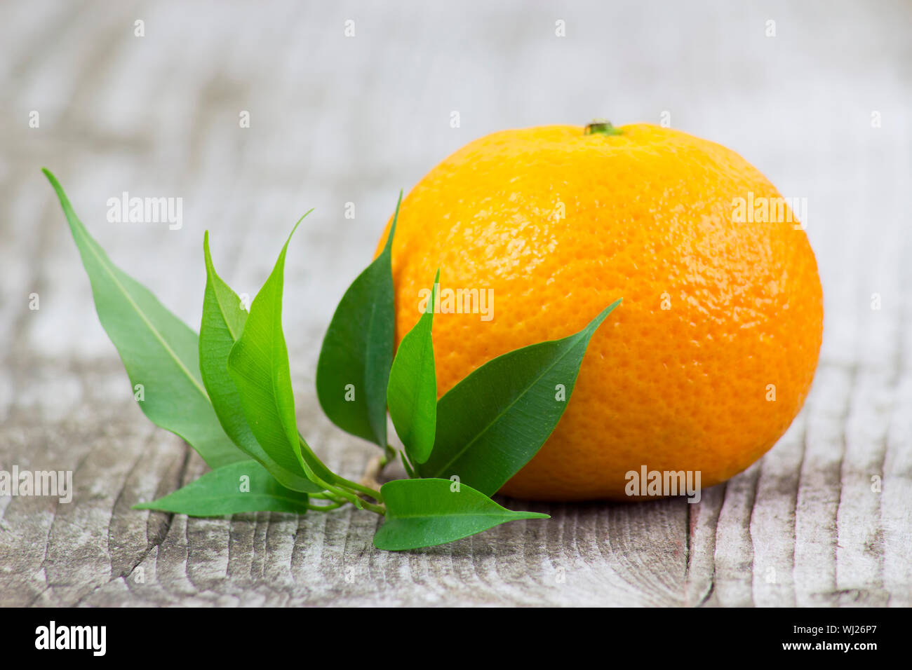 fresh tangerine on old wooden background Stock Photo - Alamy