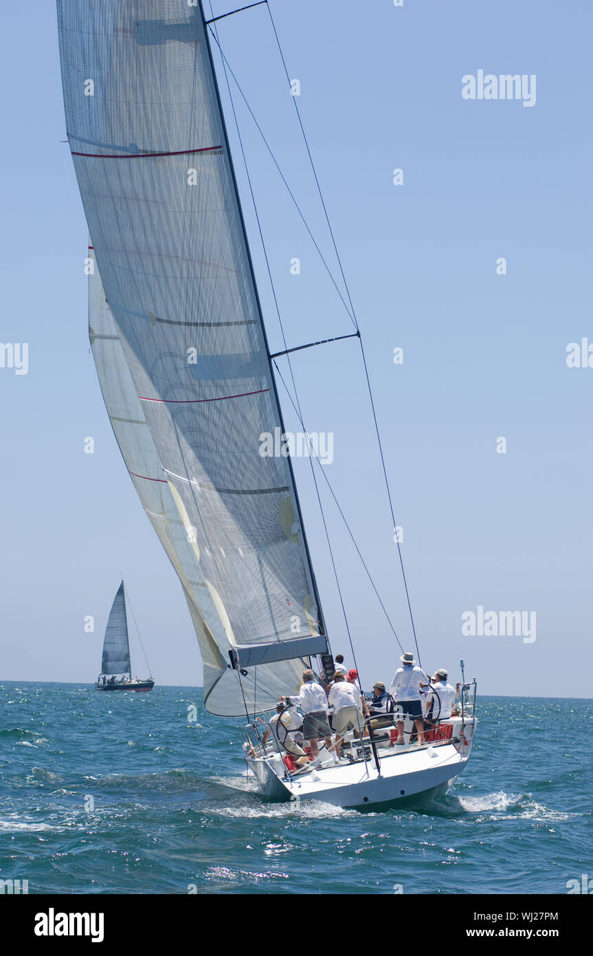 Crew on board yacht in competitive team sailing event Stock Photo - Alamy