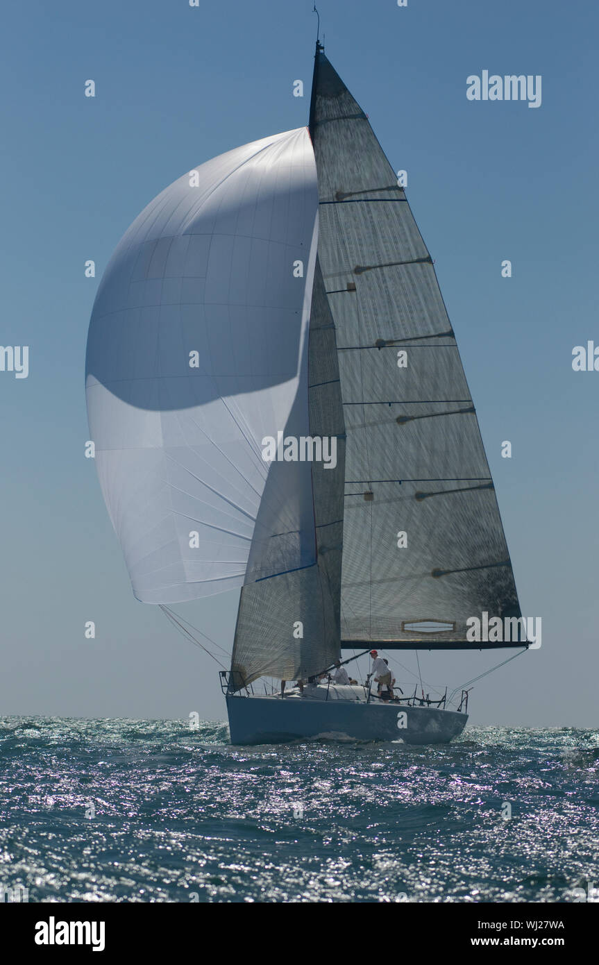 View of a yacht competing in team sailing event Stock Photo - Alamy