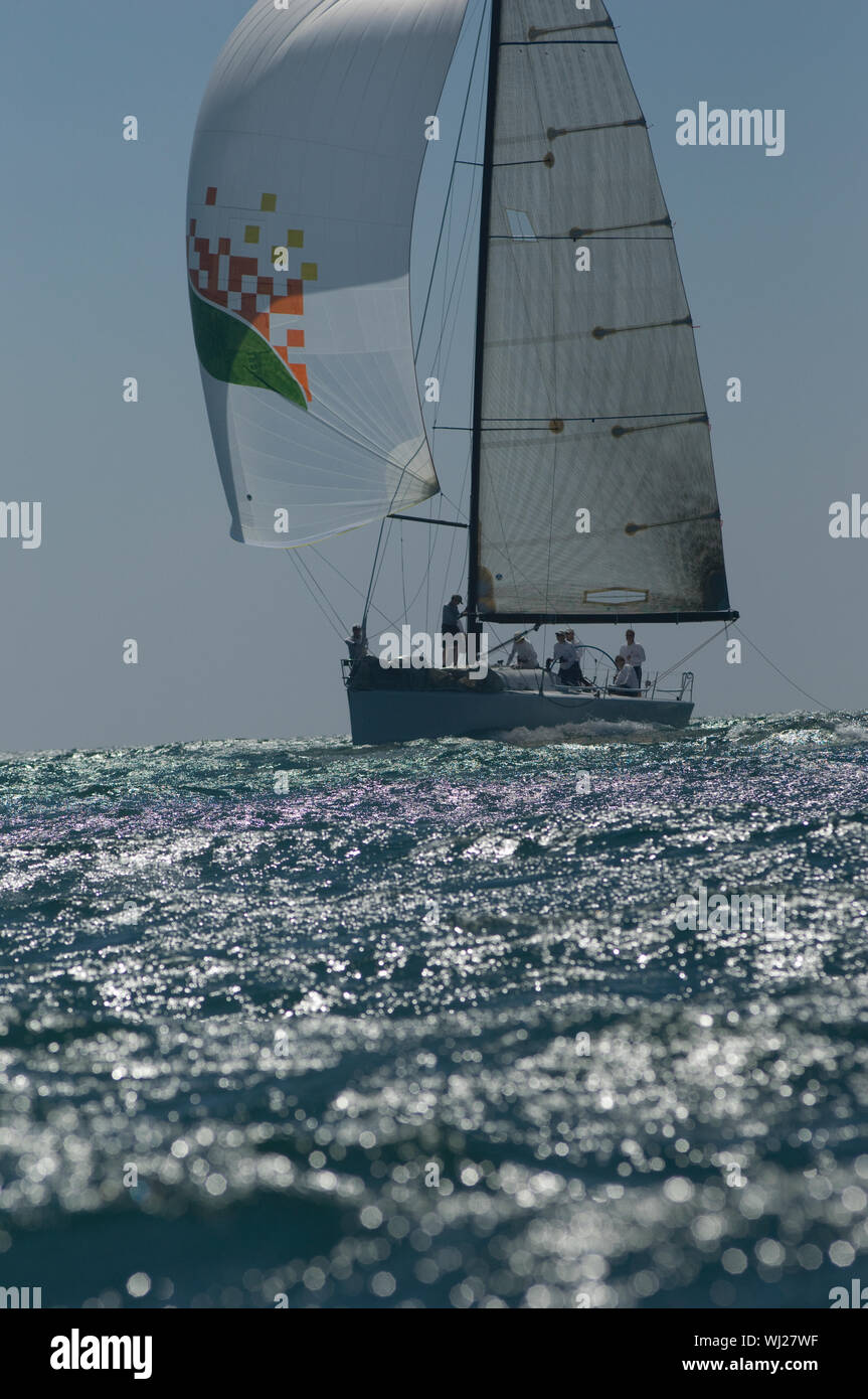 View of a yacht competing in team sailing event Stock Photo - Alamy