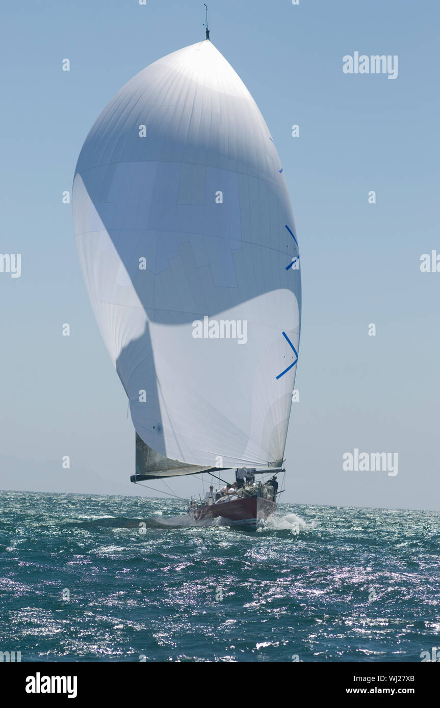 View of a yacht competing in team sailing event Stock Photo - Alamy