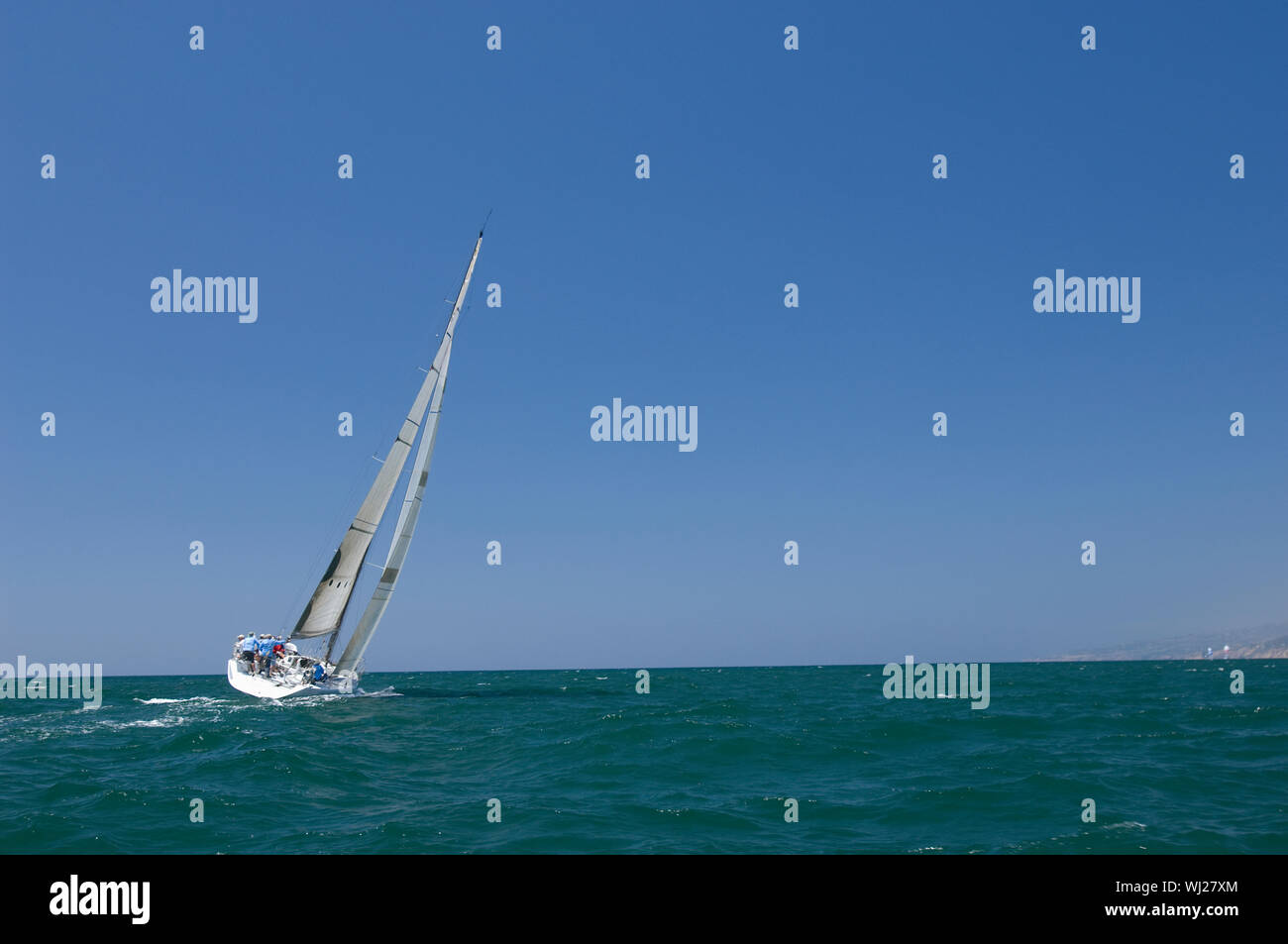 View of a yacht competing in team sailing event Stock Photo - Alamy