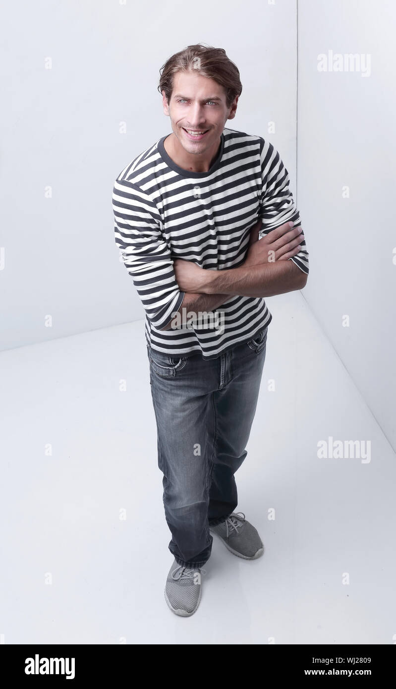 modern man standing in the corner of the white room Stock Photo - Alamy