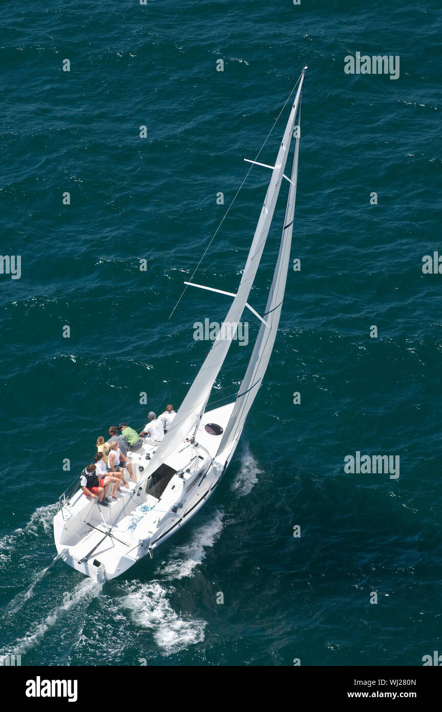 View of a yacht competing in team sailing event Stock Photo - Alamy