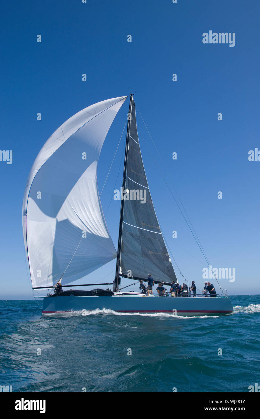 View of a yacht competing in team sailing event Stock Photo - Alamy
