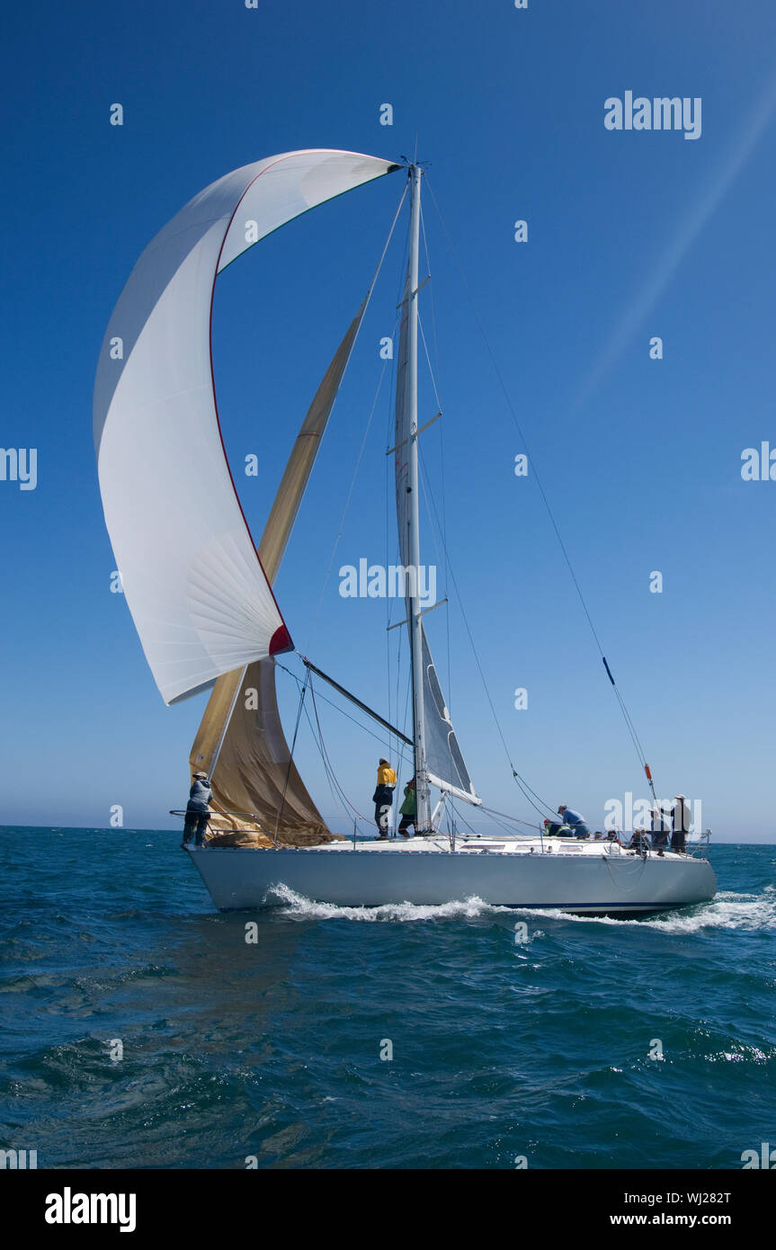 View of a yacht competing in team sailing event Stock Photo - Alamy