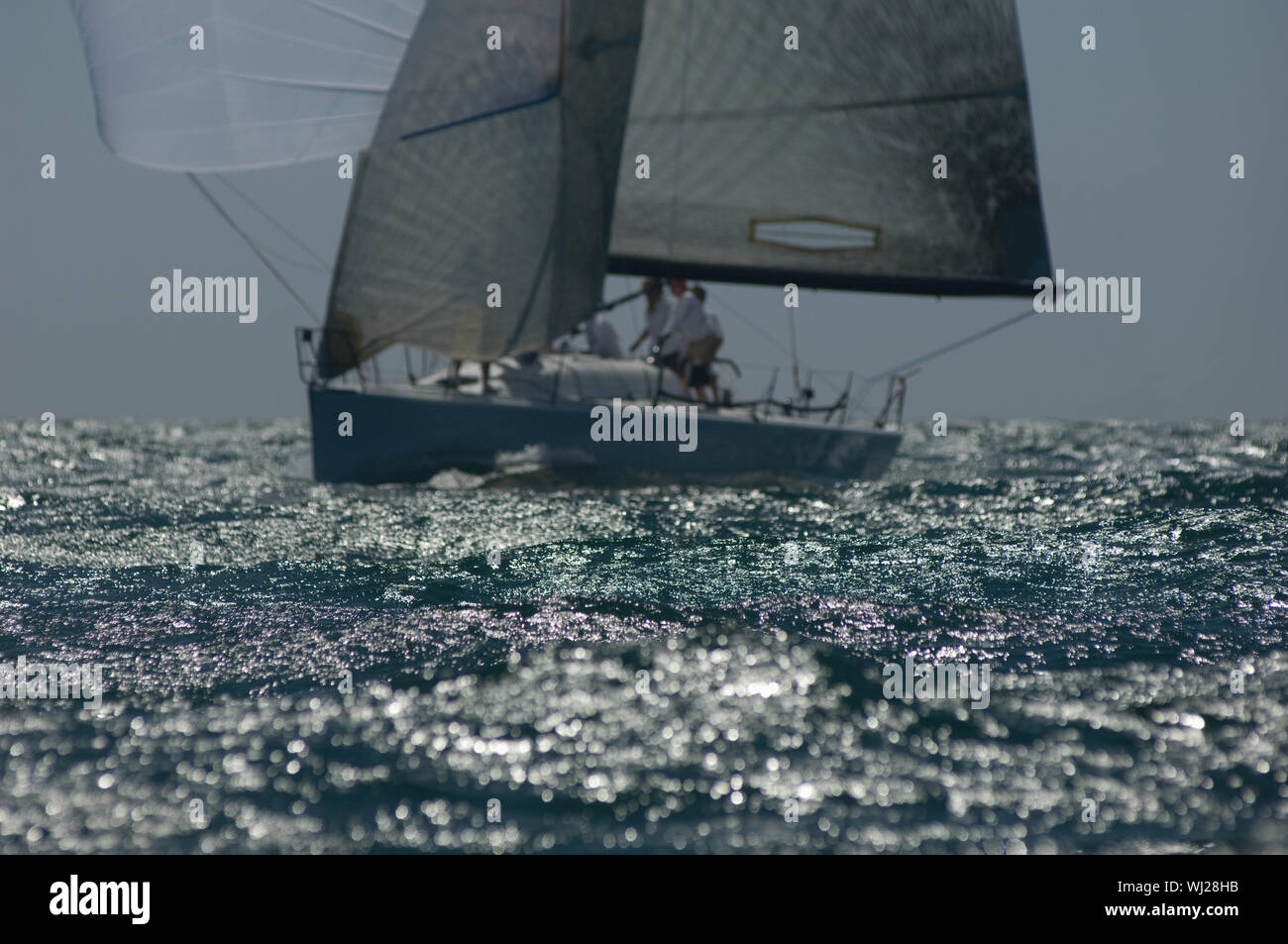 View of a yacht competing in team sailing event Stock Photo - Alamy