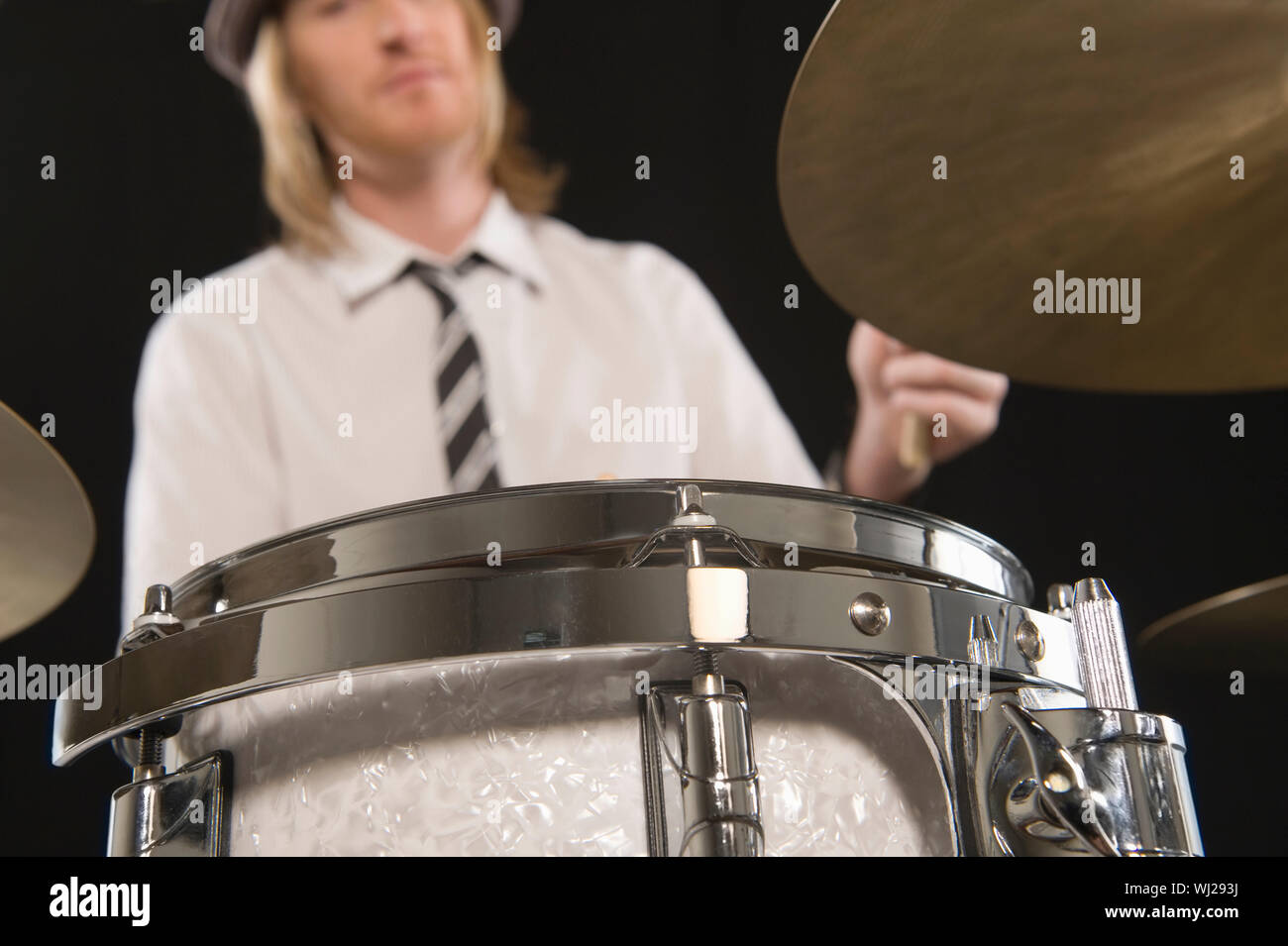 Close up of a drum with man isolated over black background Stock Photo ...