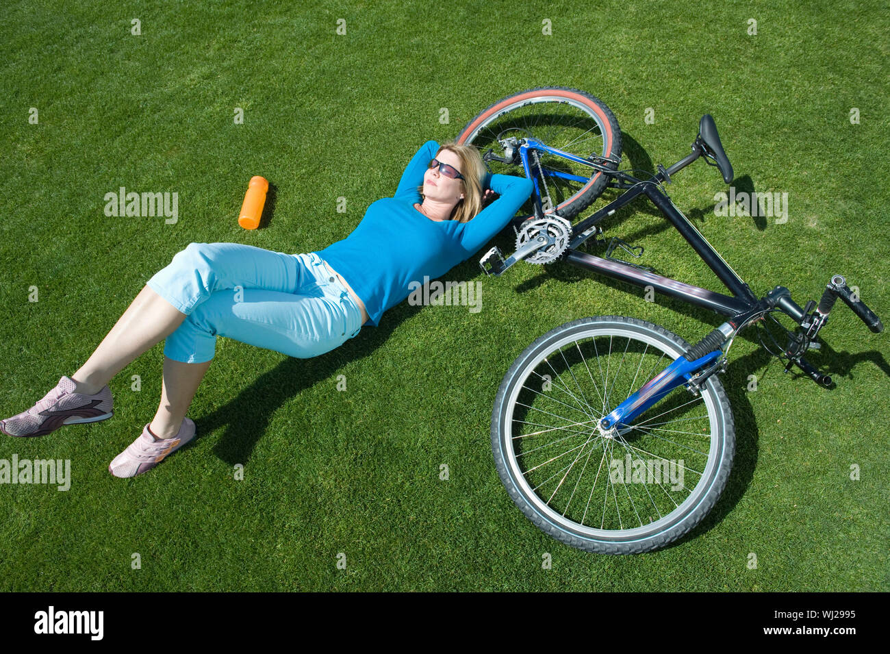 Female bicycle lying ground hi-res stock photography and images - Alamy