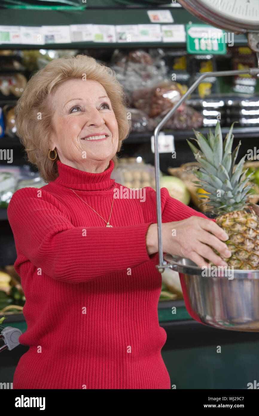 Woman weighing produce in supermarket hi-res stock photography and images - Alamy