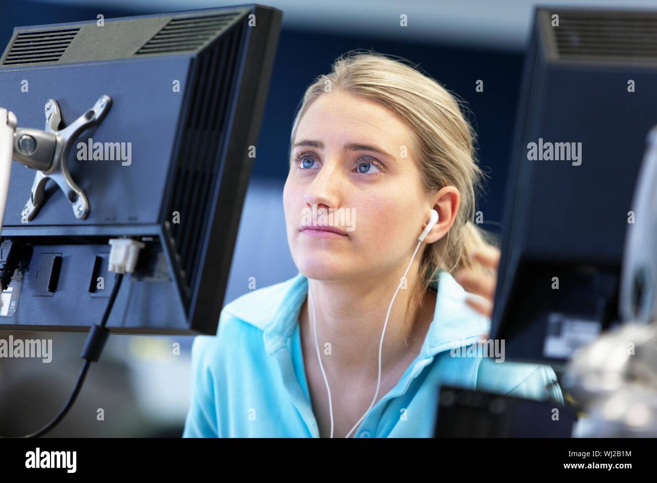 Student Using Computer And Listening Music Stock Photo - Alamy
