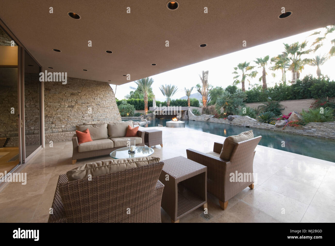 View of an outdoor room by swimming pool of a modern home Stock Photo ...