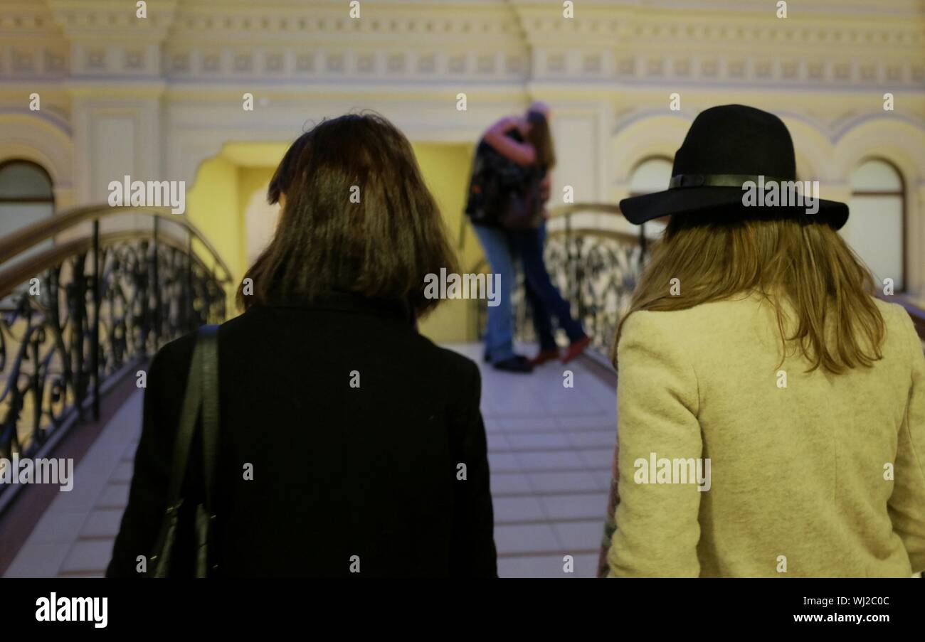 Women hugging rear view hi-res stock photography and images - Alamy