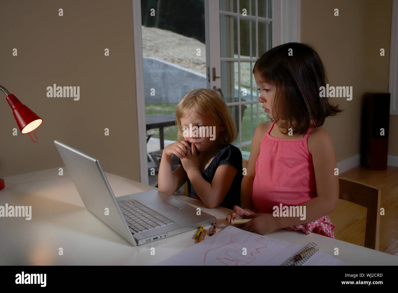 Two young girls using computer in study room Stock Photo - Alamy