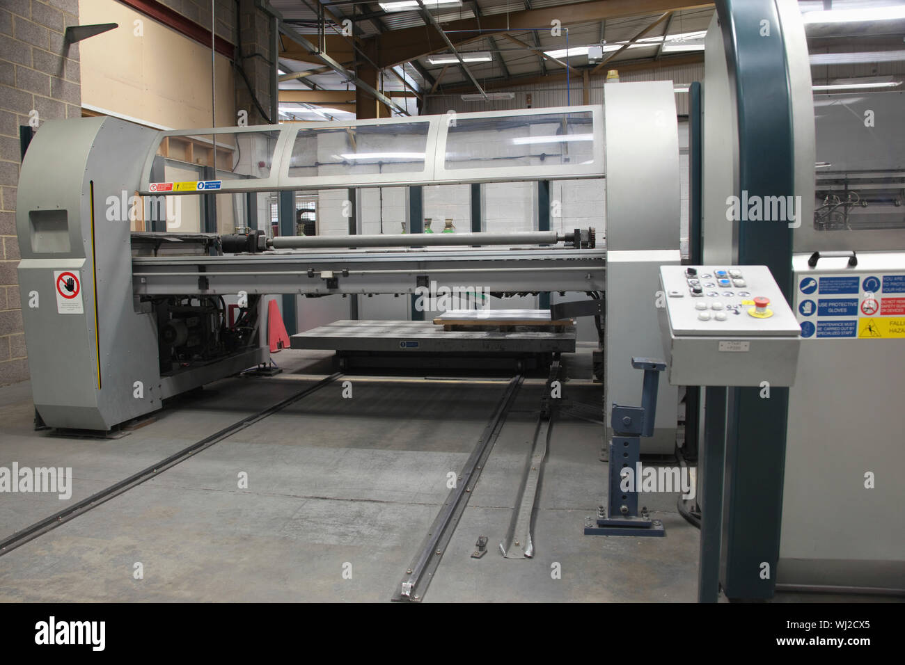 Sheet metal folding machine with loading platform Stock Photo - Alamy