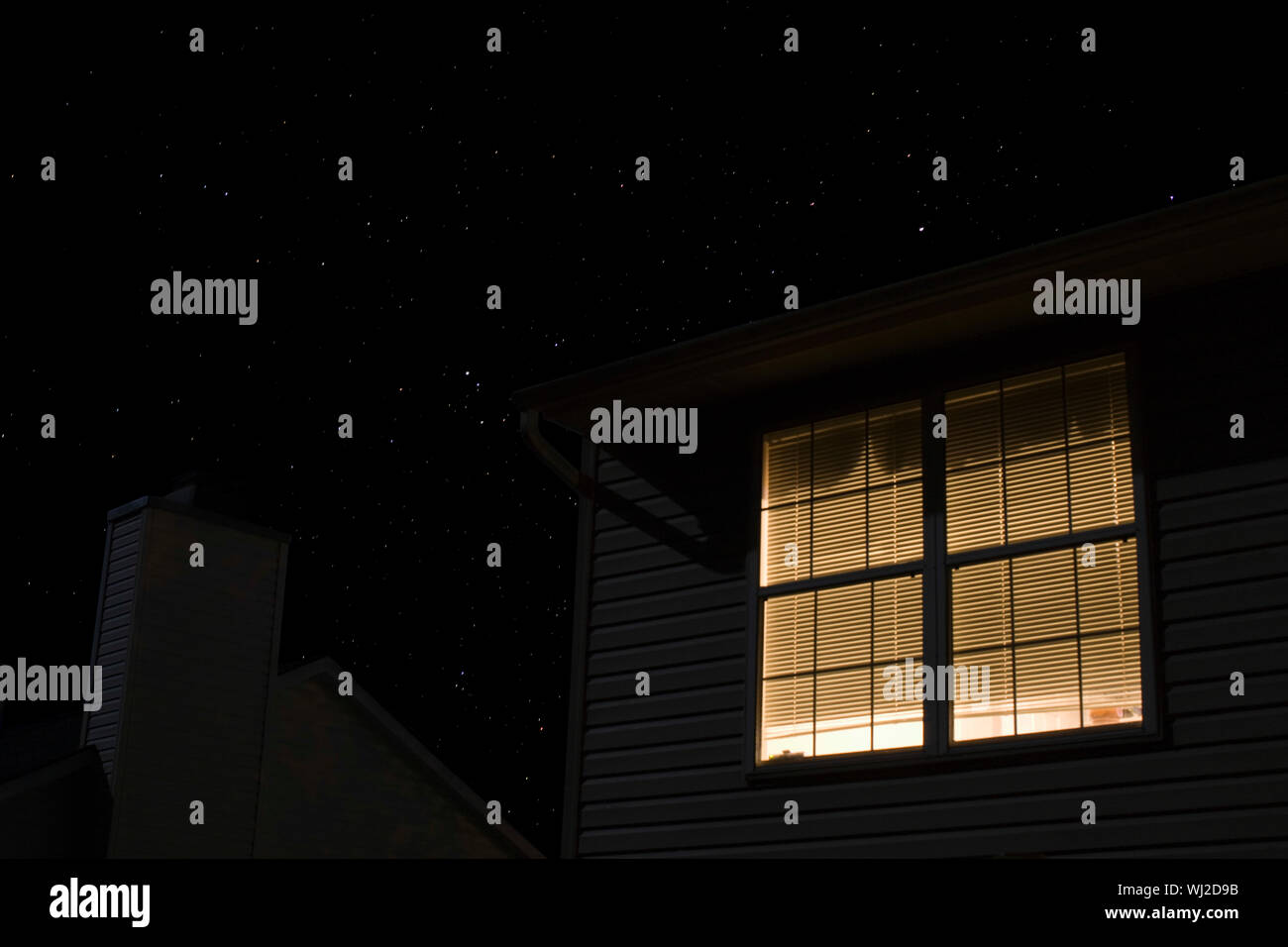 Lit window of building exterior at night Stock Photo - Alamy