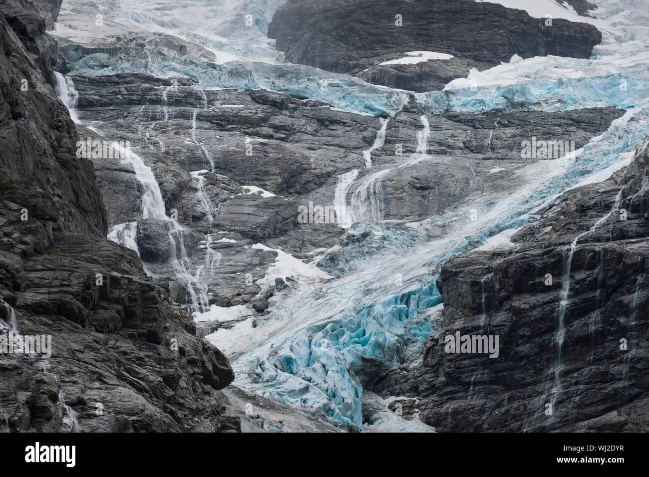 Norwegian rock face and waterfall Stock Photo - Alamy