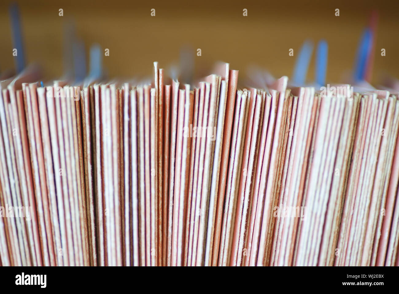 Closeup of colour coded filing system for folders Stock Photo - Alamy