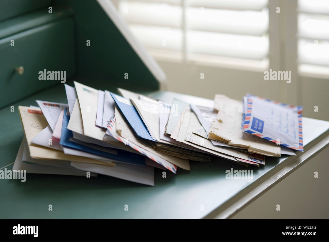 Closeup of letters on writing desk at home Stock Photo - Alamy