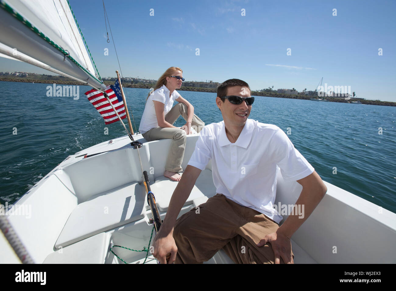Two men together on sailboat hi-res stock photography and images - Alamy
