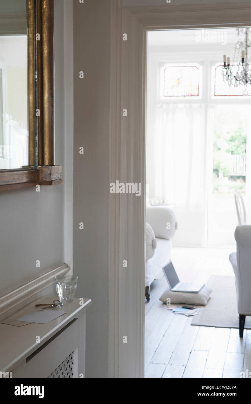 View through doorframe from hallway to living room Stock Photo - Alamy