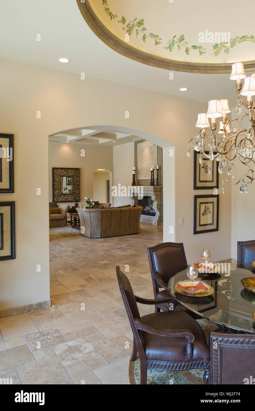 View through archway from dining room with ceiling detail Stock Photo ...