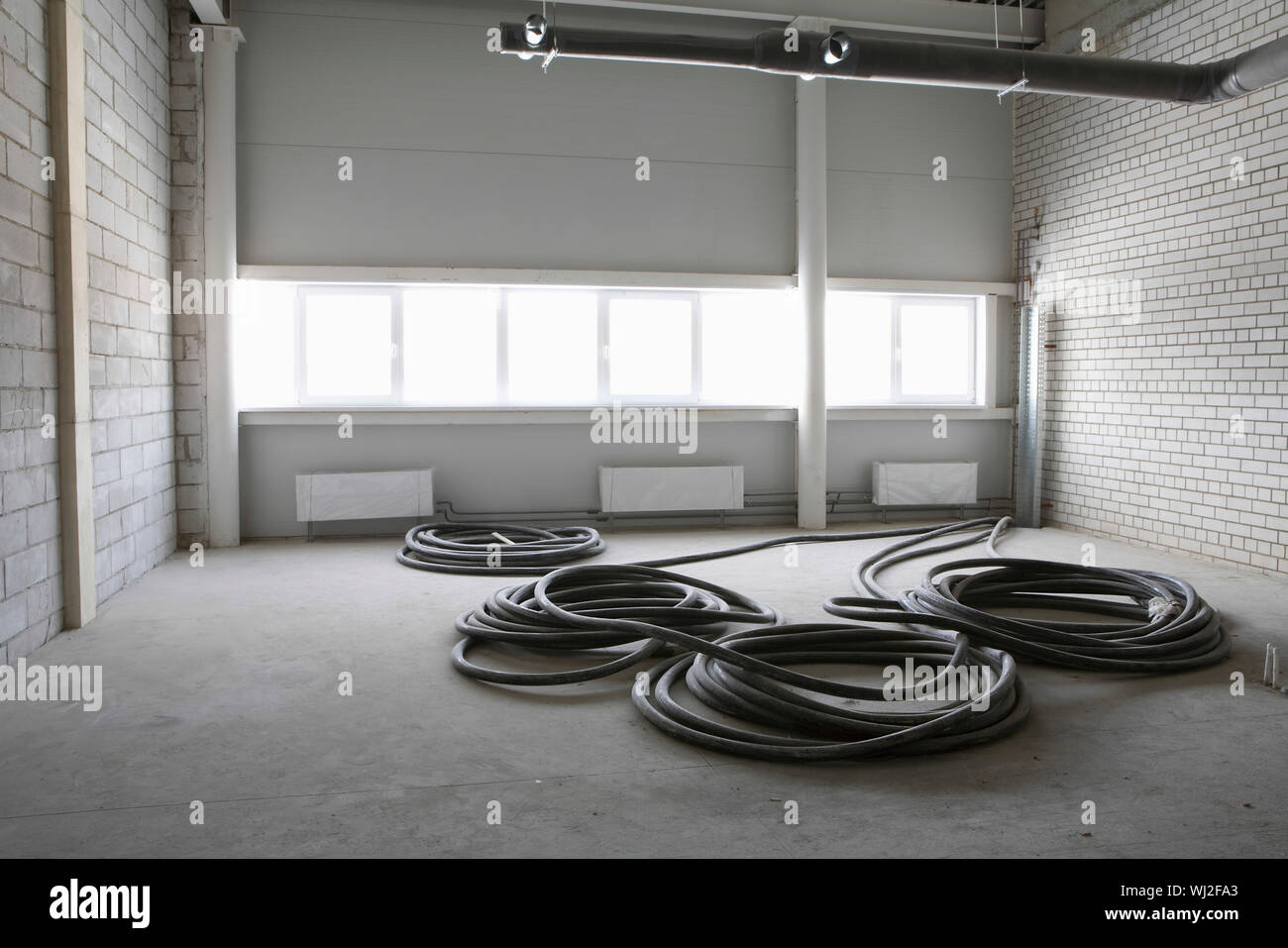 Cable wires in empty warehouse Stock Photo - Alamy