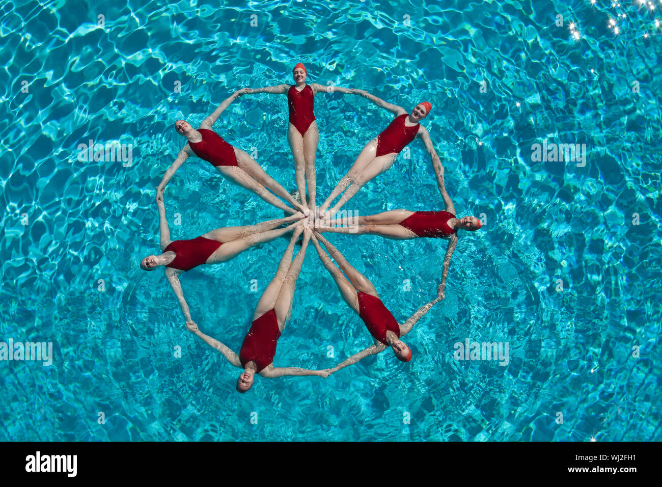 Elevated view of synchronised swimmers forming a circle in pool Stock ... Elevated view of synchronised swimmers forming a circle in pool Stock ...