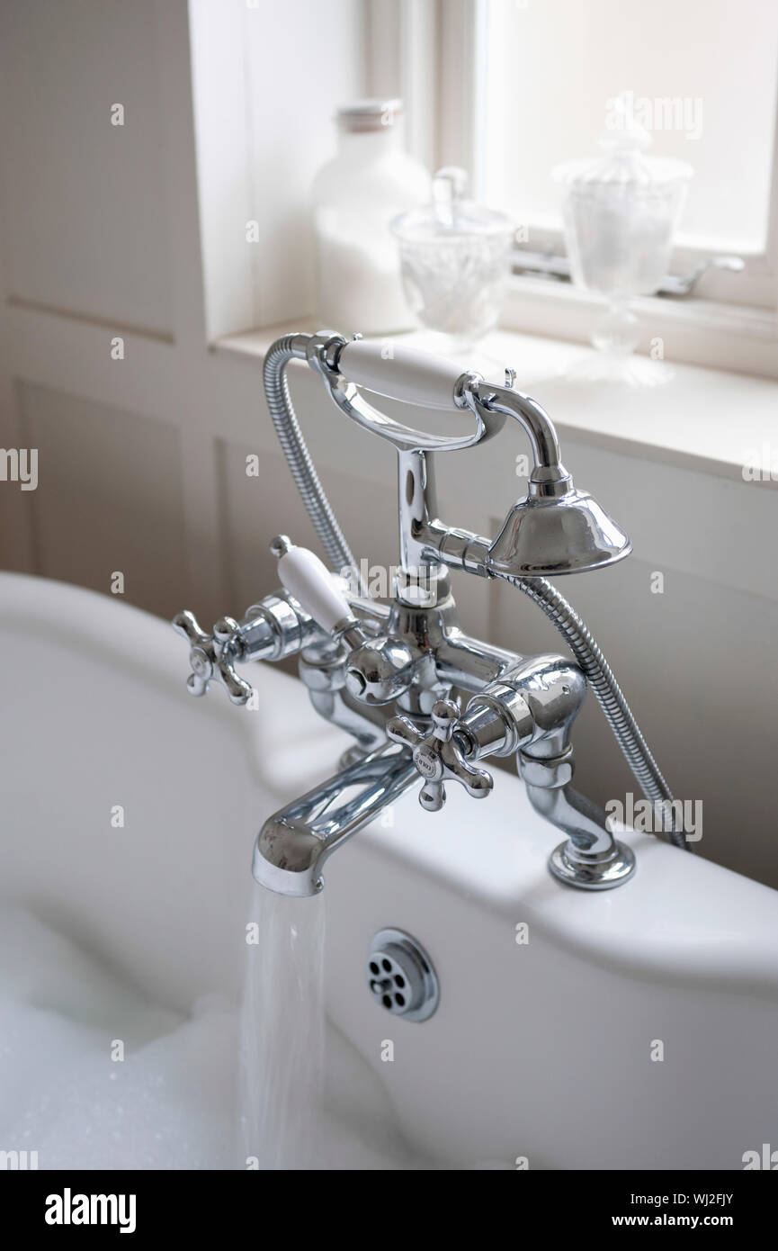 Shower fitting with running tap in bathroom Stock Photo - Alamy