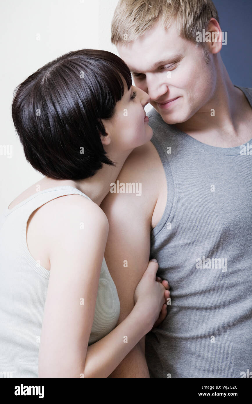 Romantic young couple rubbing noses Stock Photo - Alamy