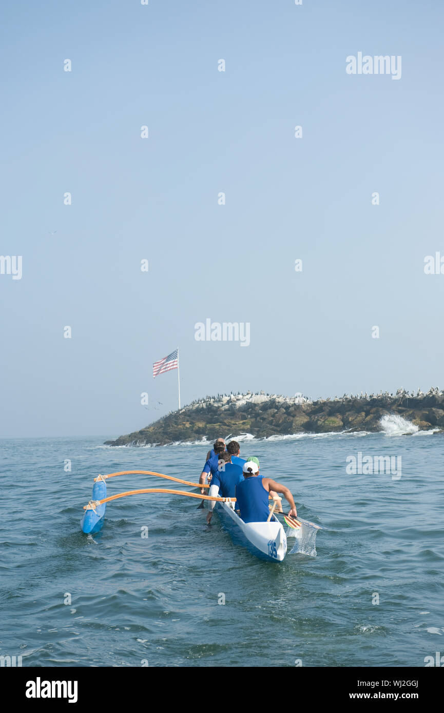 Man and woman on outrigger boat hi-res stock photography and images - Alamy