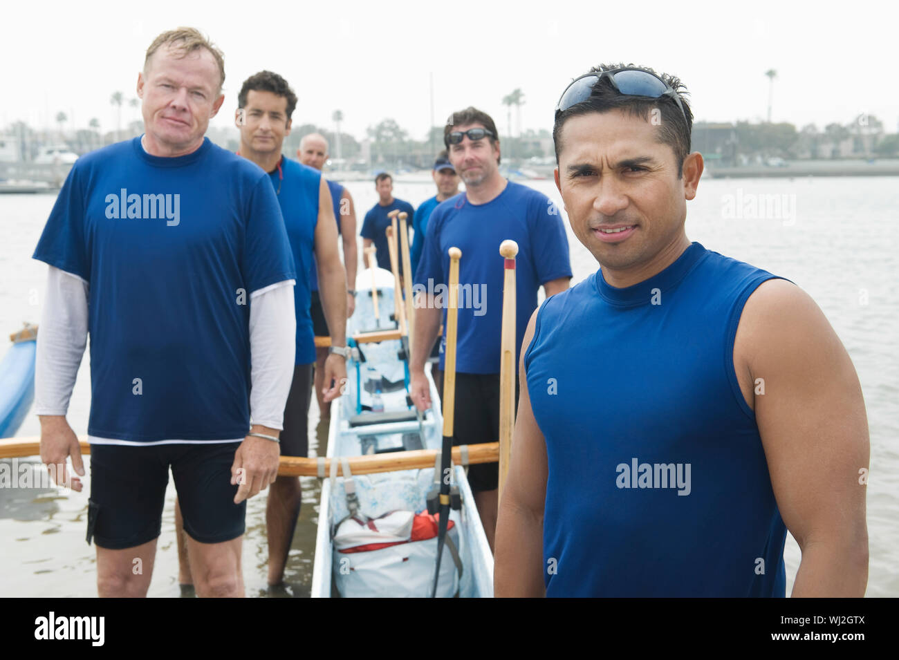 Group portrait of multiethnic outrigger canoeing team Stock Photo - Alamy