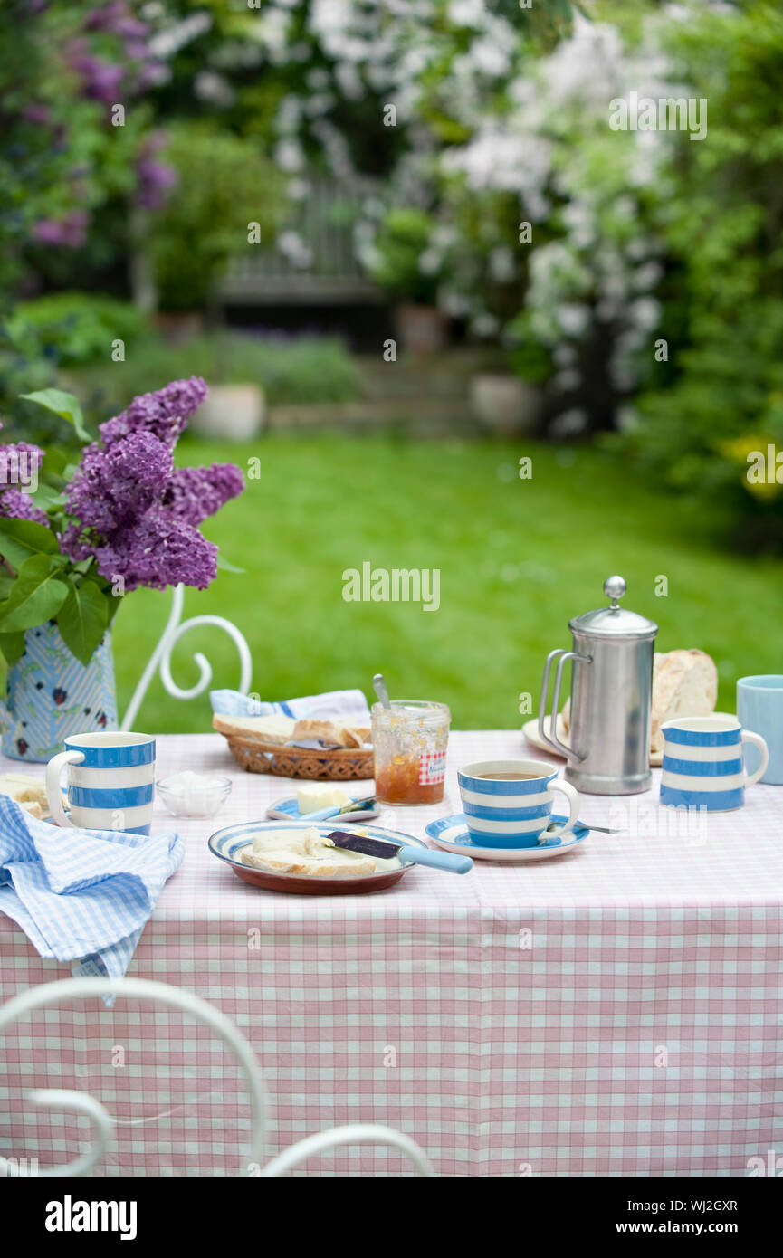 View of breakfast table in backyard Stock Photo - Alamy