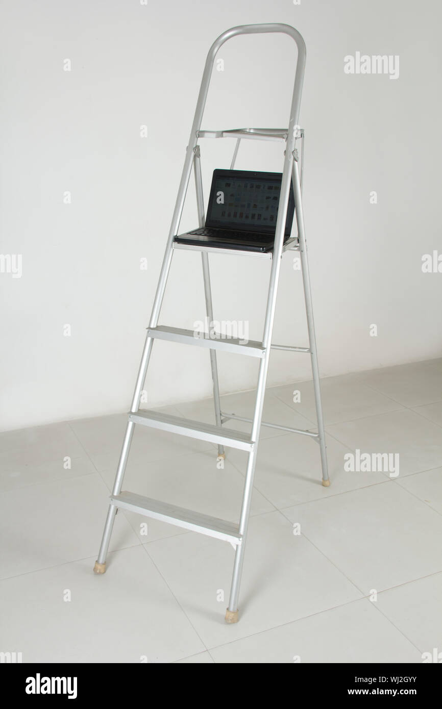 Open Laptop on step ladder Stock Photo - Alamy